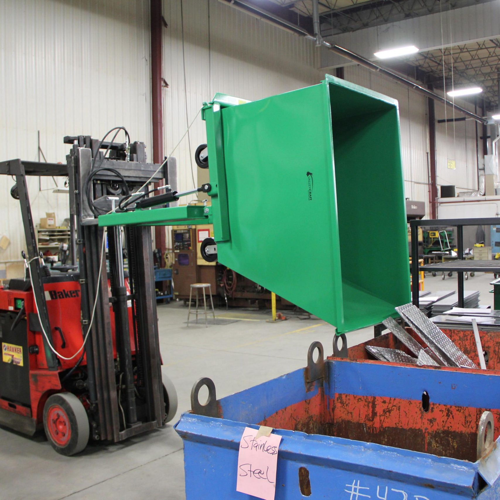 Powered Self-Dumping System Forklift Attachment